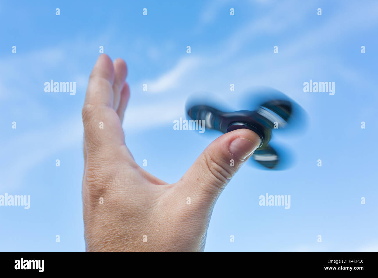 Rotating fidget spinner hi-res stock photography and images - Alamy