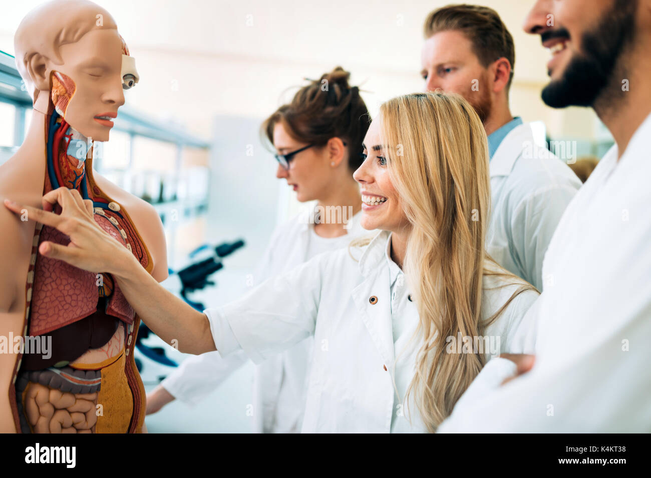 Students of medicine examining anatomical model in classroom Stock ...