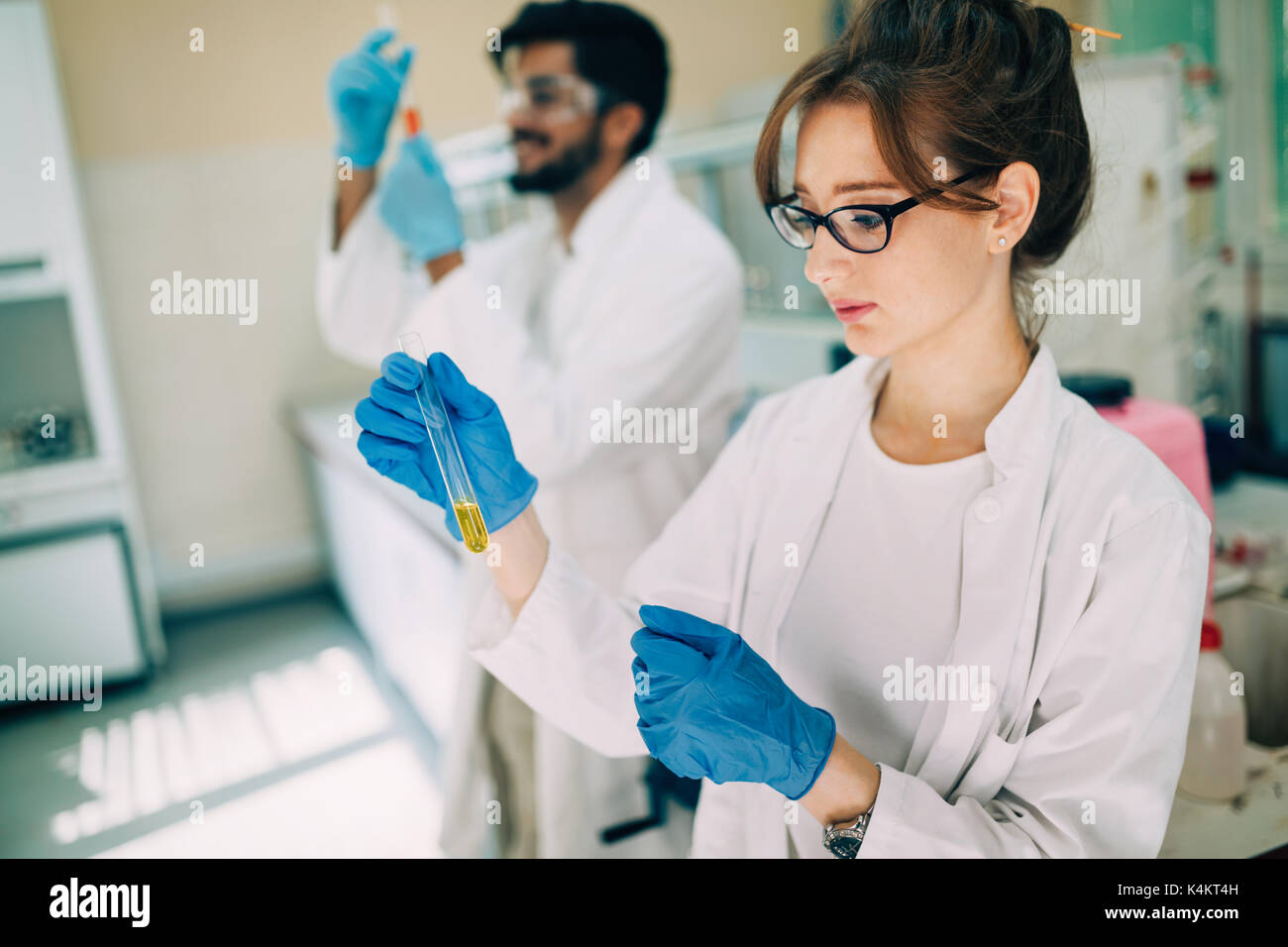 Young students of chemistry working in laboratory Stock Photo - Alamy