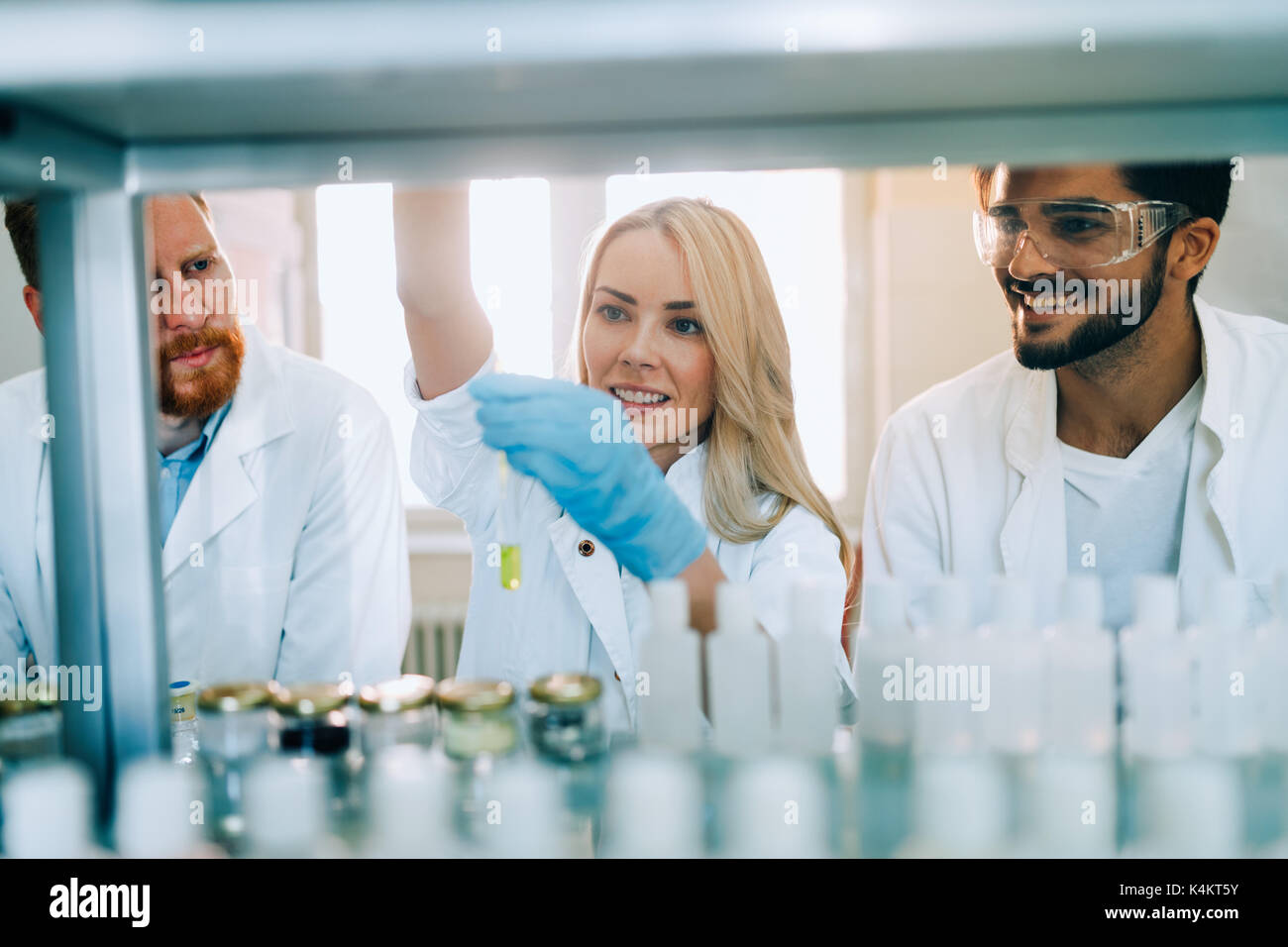 Group of chemistry students working in laboratory Stock Photo - Alamy