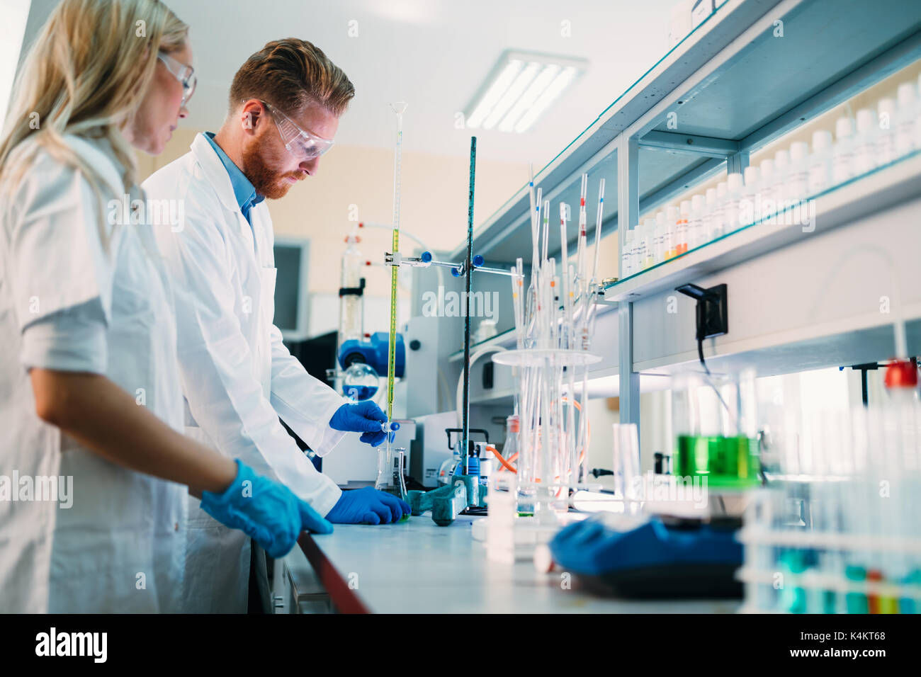 Young students of chemistry working in laboratory Stock Photo - Alamy