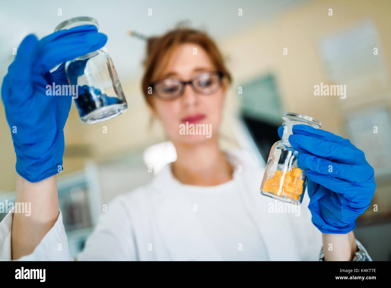 Female student of chemistry working in laboratory Stock Photo - Alamy