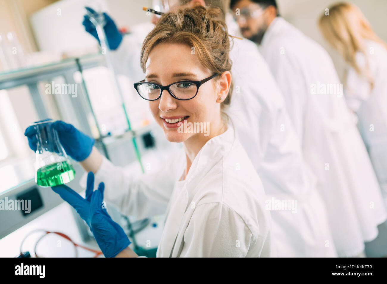 Female student of chemistry working in laboratory Stock Photo - Alamy