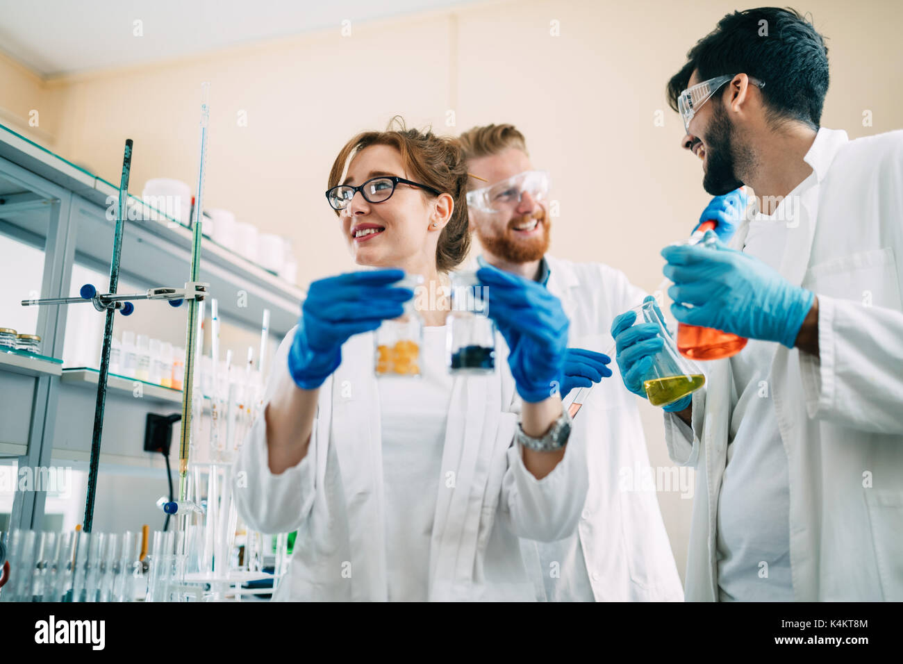 Group of chemistry students working in laboratory Stock Photo - Alamy
