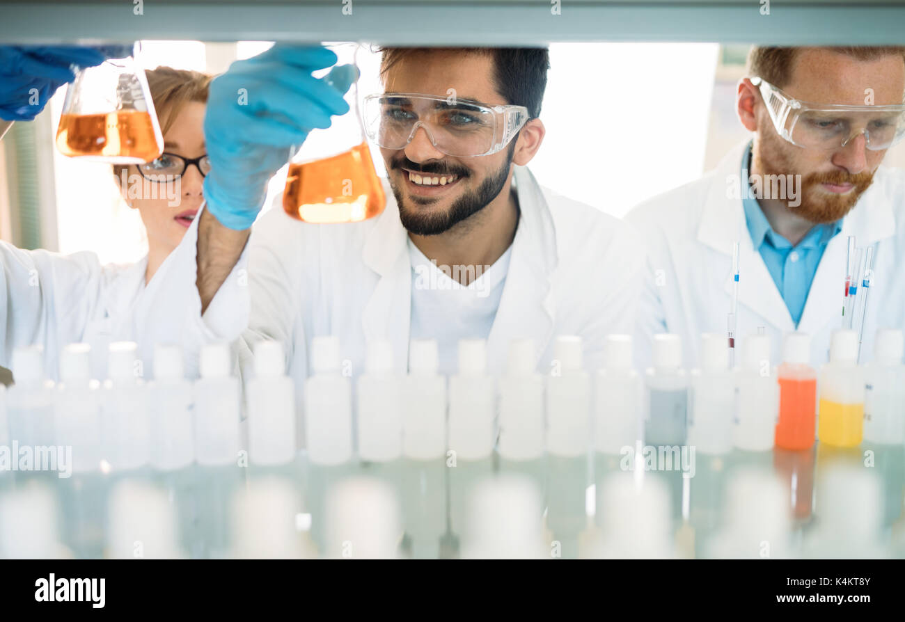 Group of chemistry students working in laboratory Stock Photo - Alamy
