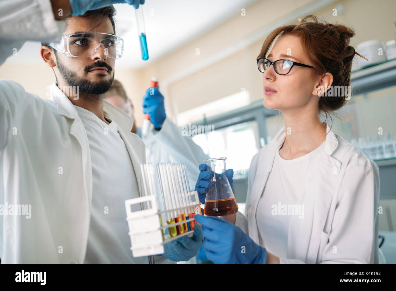 Young students of chemistry working in laboratory Stock Photo - Alamy