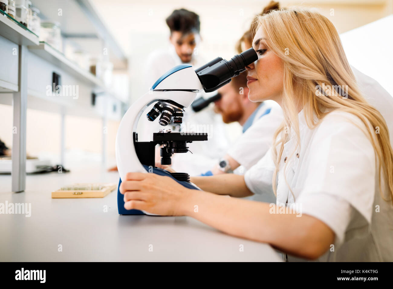 Laboratory woman microscope hi-res stock photography and images - Alamy