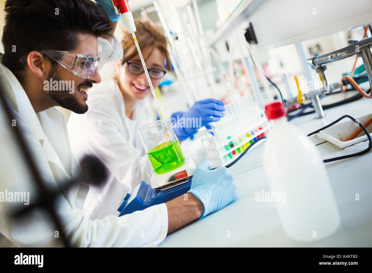 Young students of chemistry working in laboratory Stock Photo - Alamy