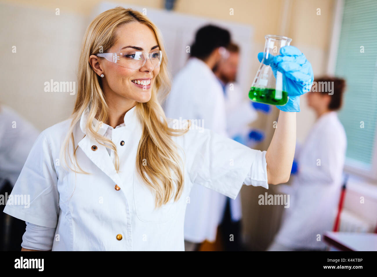 Female student of chemistry working in laboratory Stock Photo - Alamy