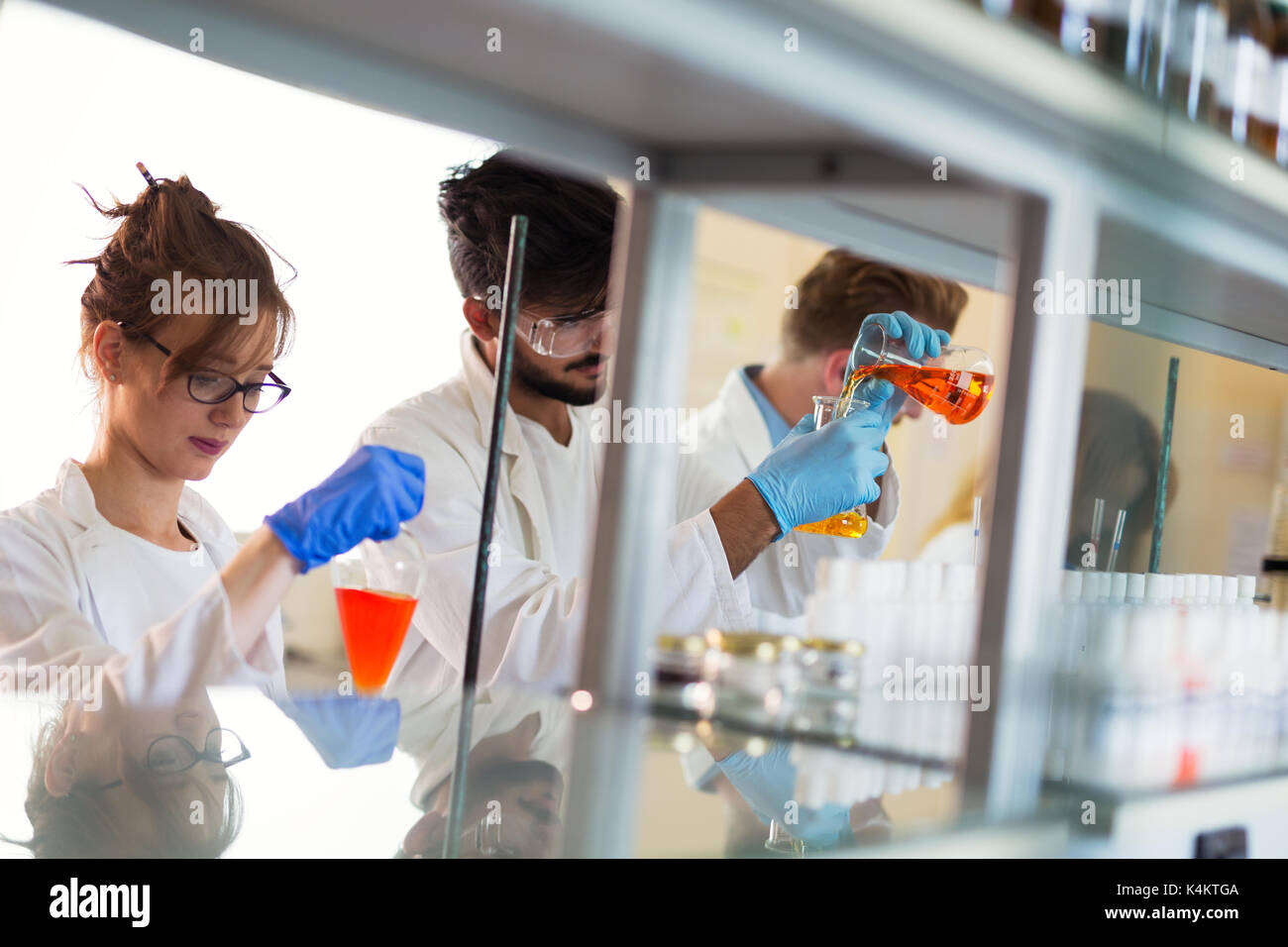 Young students of chemistry working in laboratory Stock Photo - Alamy