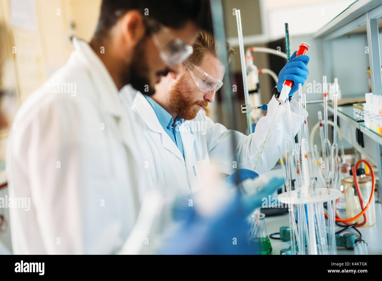 Young students of chemistry working in laboratory Stock Photo - Alamy