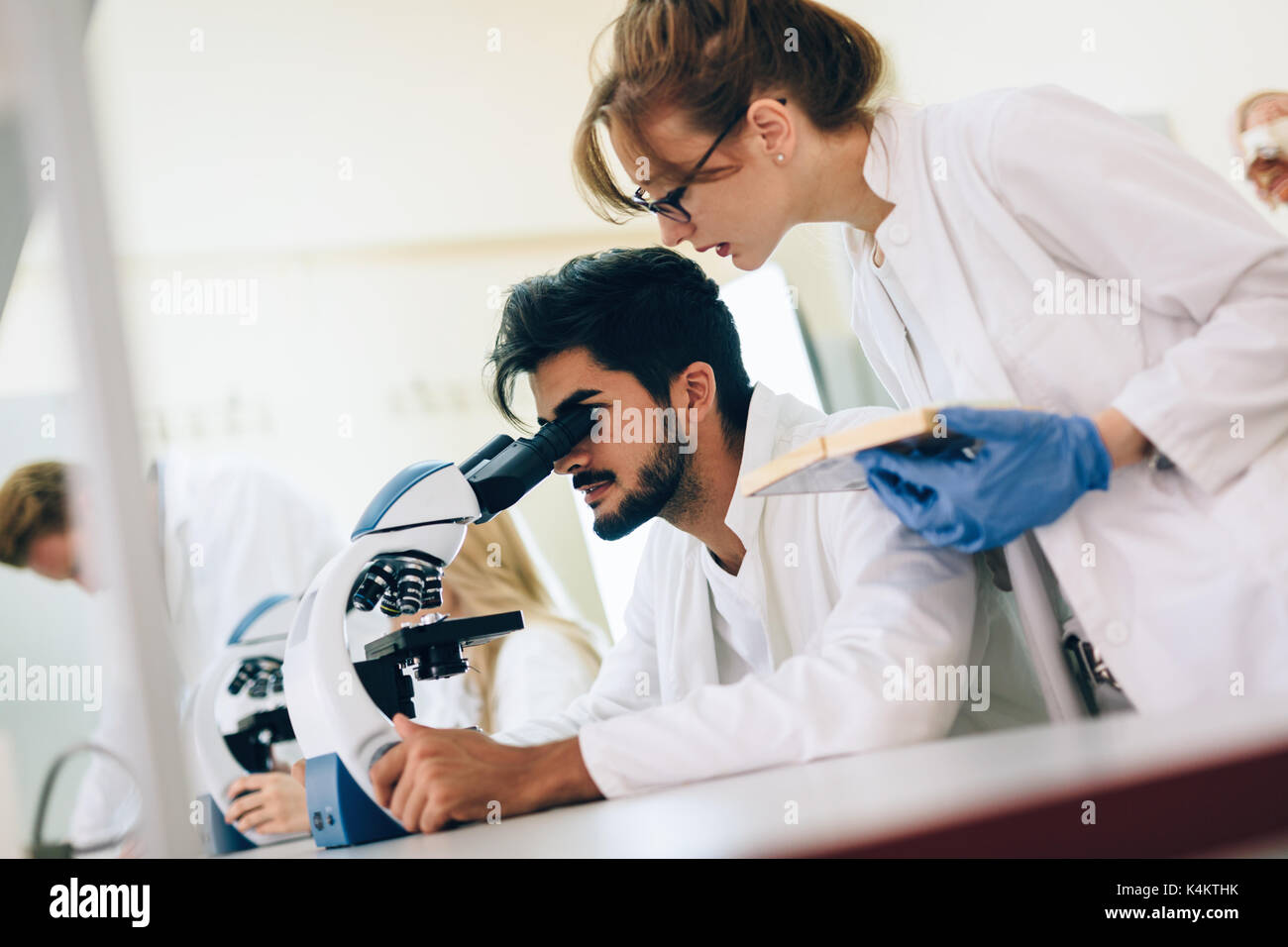 Male scientist looking microscope hi-res stock photography and images - Alamy
