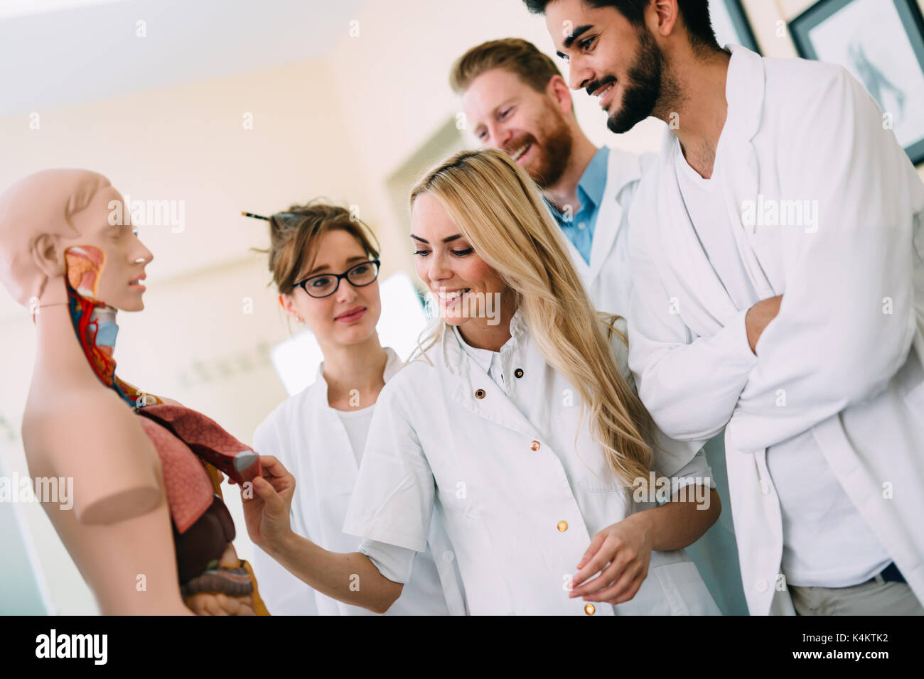 Students of medicine examining anatomical model in classroom Stock ...