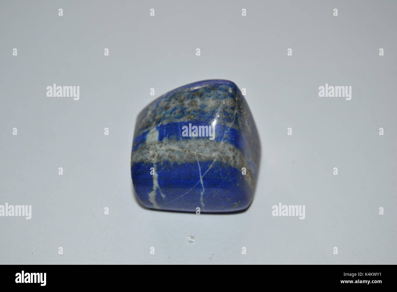 Lapis lazuli on a white background Stock Photo - Alamy