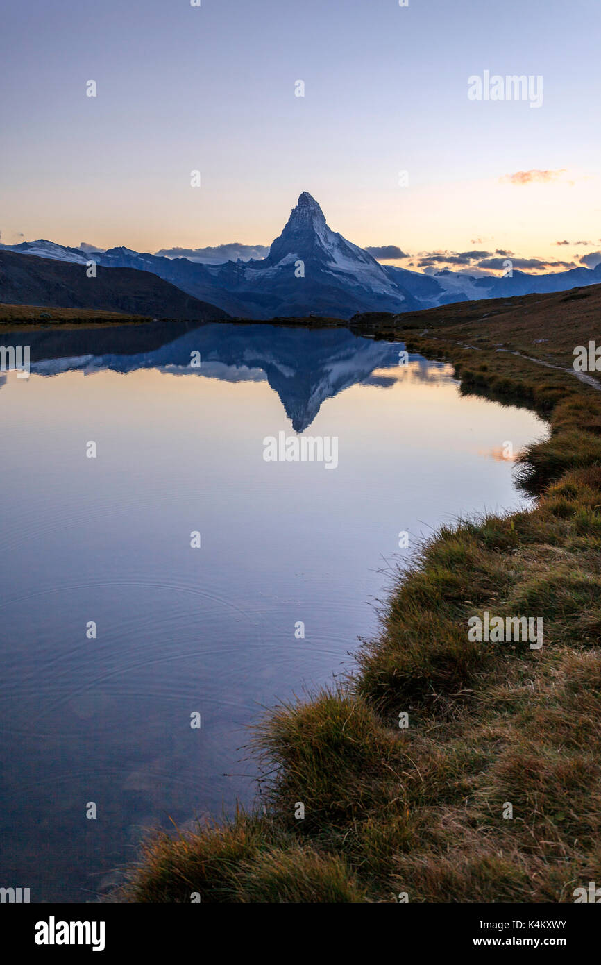 The Matterhorn reflected in Stellisee at sunset. Zermatt Canton of ...