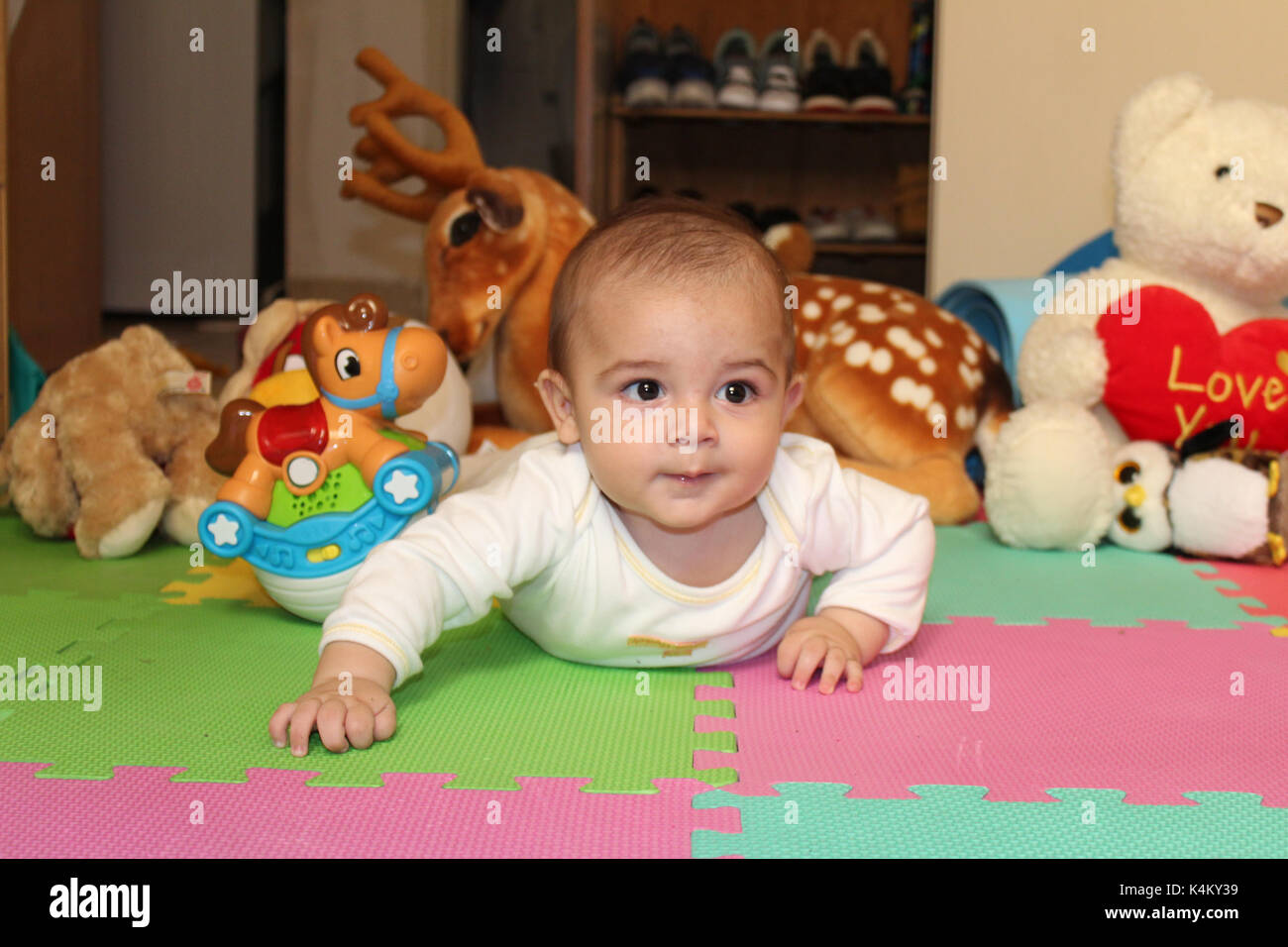 five month old baby boy playing with toys Stock Photo - Alamy