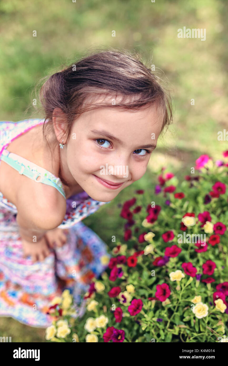 Smiling girl smiles flowers Stock Photo - Alamy