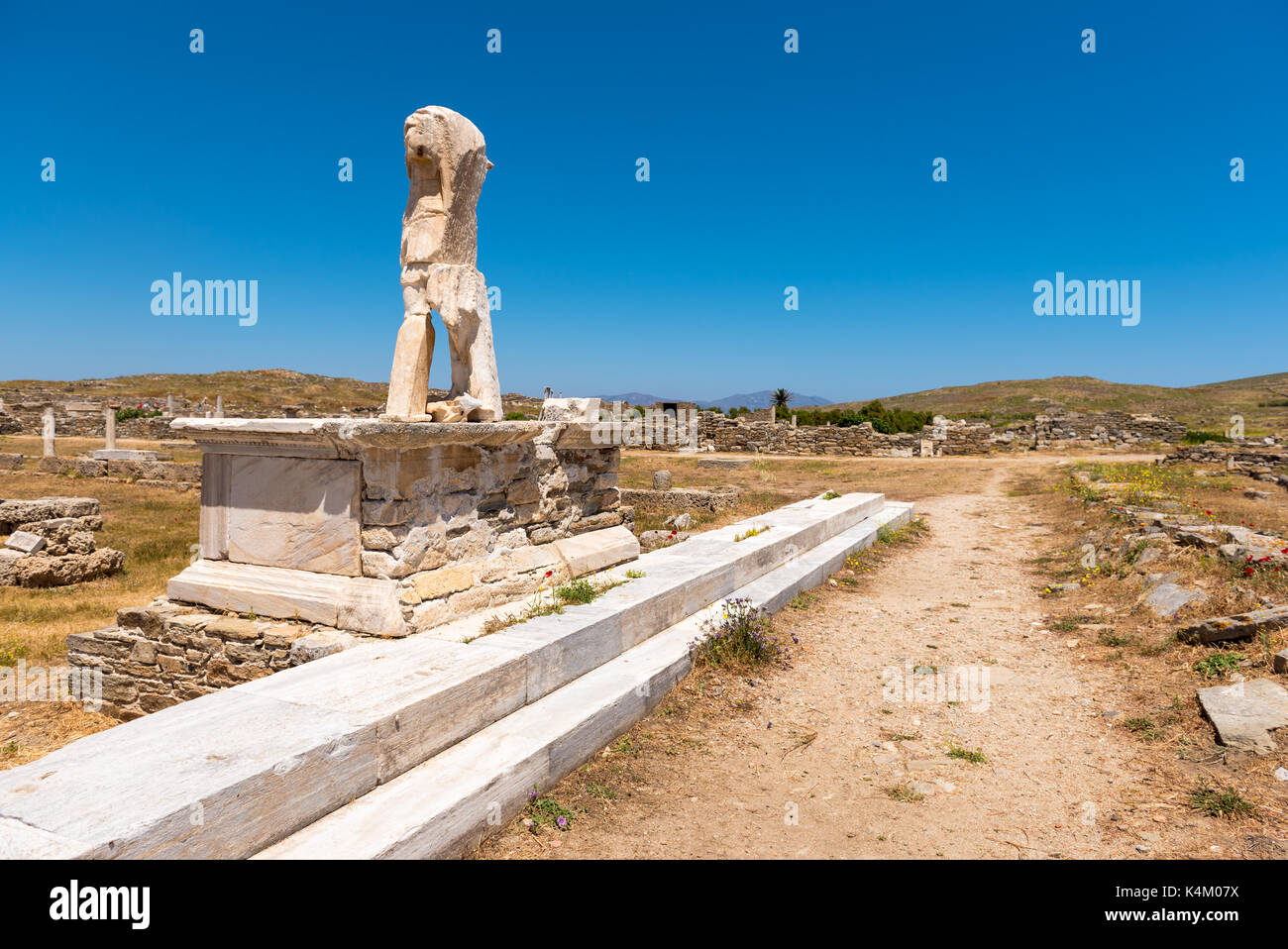 Archaeological ruins of a city in Delos island in Cyclades archipelago ...