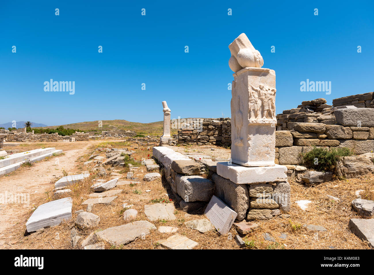 Archaeological ruins of a city in Delos island in Cyclades archipelago ...