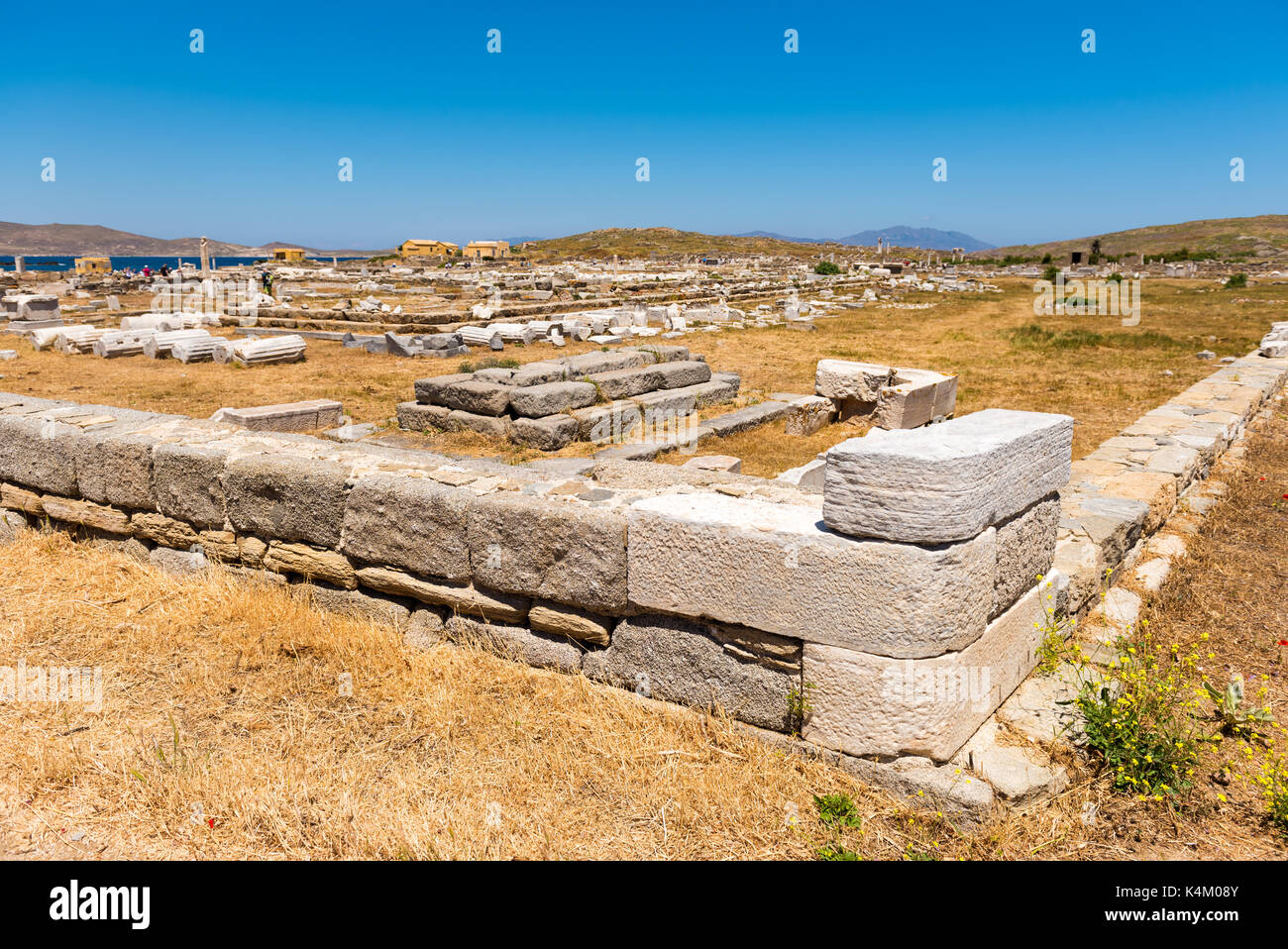 Archaeological ruins of a city in Delos island in Cyclades archipelago ...