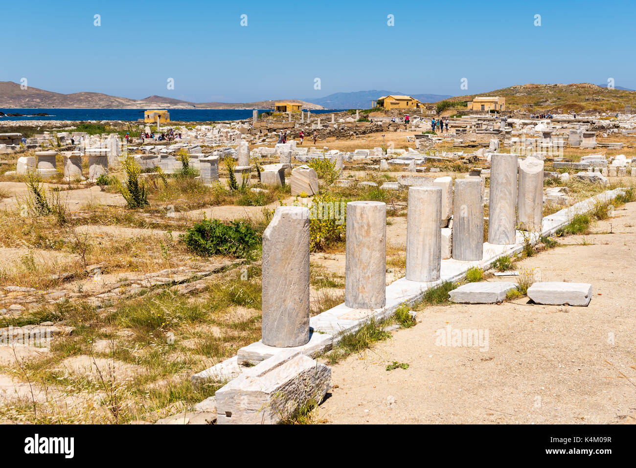 Archaeological ruins of a city in Delos island in Cyclades archipelago ...
