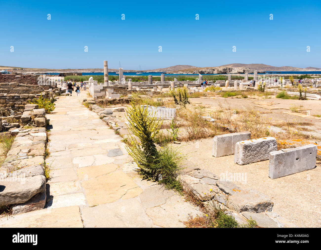 Archaeological ruins of a city in Delos island in Cyclades archipelago ...