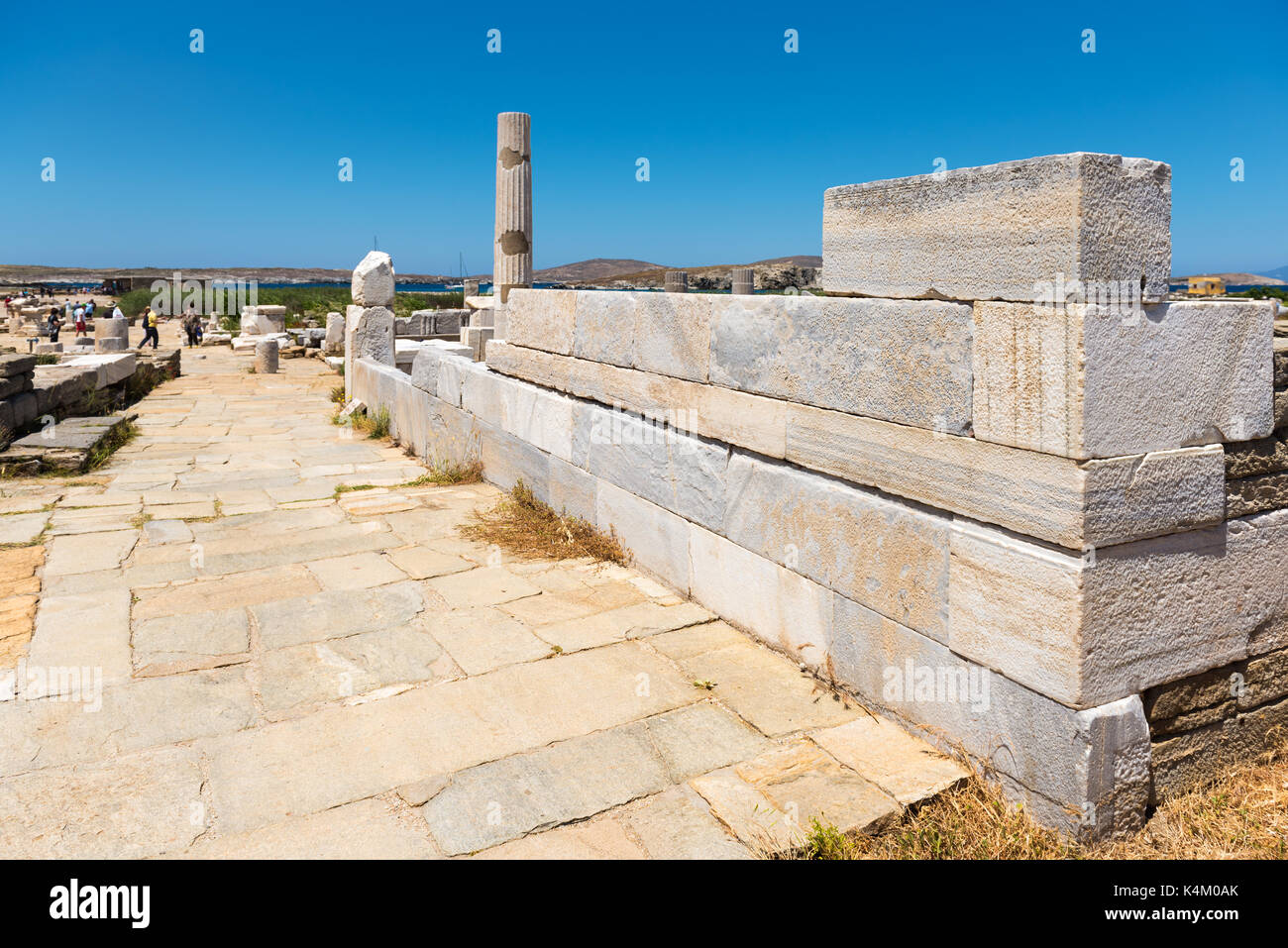 Archaeological ruins of a city in Delos island in Cyclades archipelago ...