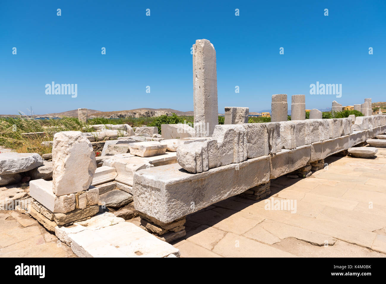 Archaeological ruins of a city in Delos island in Cyclades archipelago ...