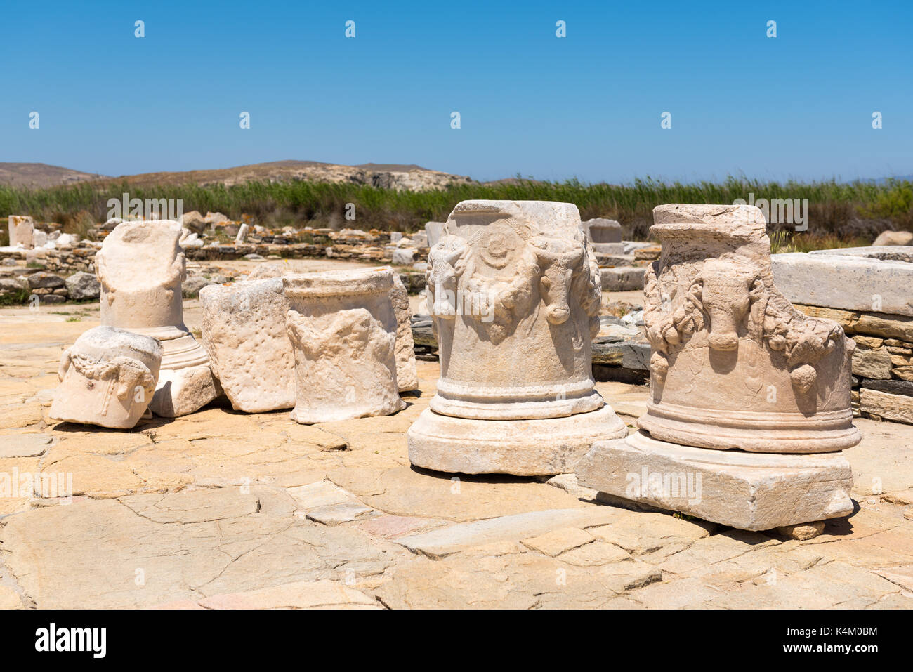 Archaeological ruins of a city in Delos island in Cyclades archipelago ...