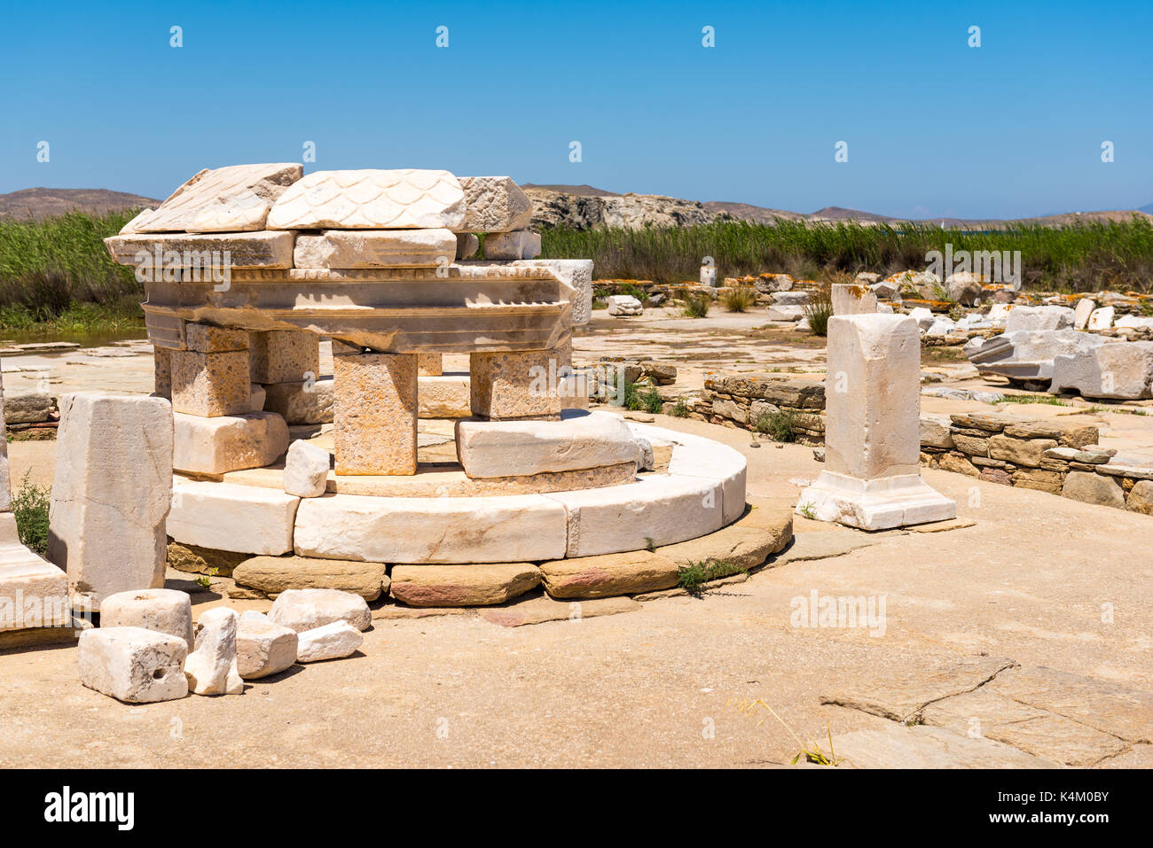 Archaeological ruins of a city in Delos island in Cyclades archipelago ...