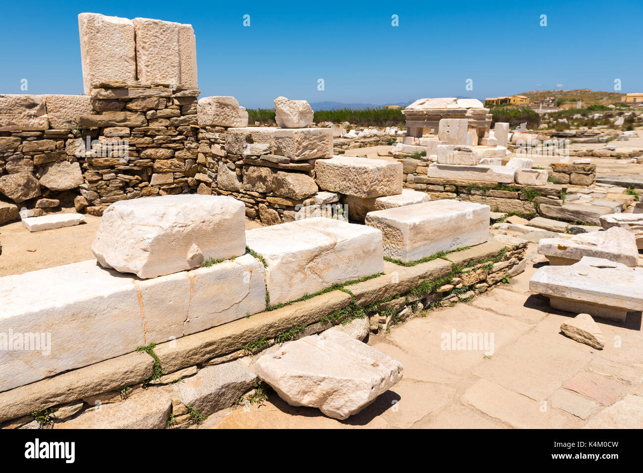 Archaeological ruins of a city in Delos island in Cyclades archipelago ...
