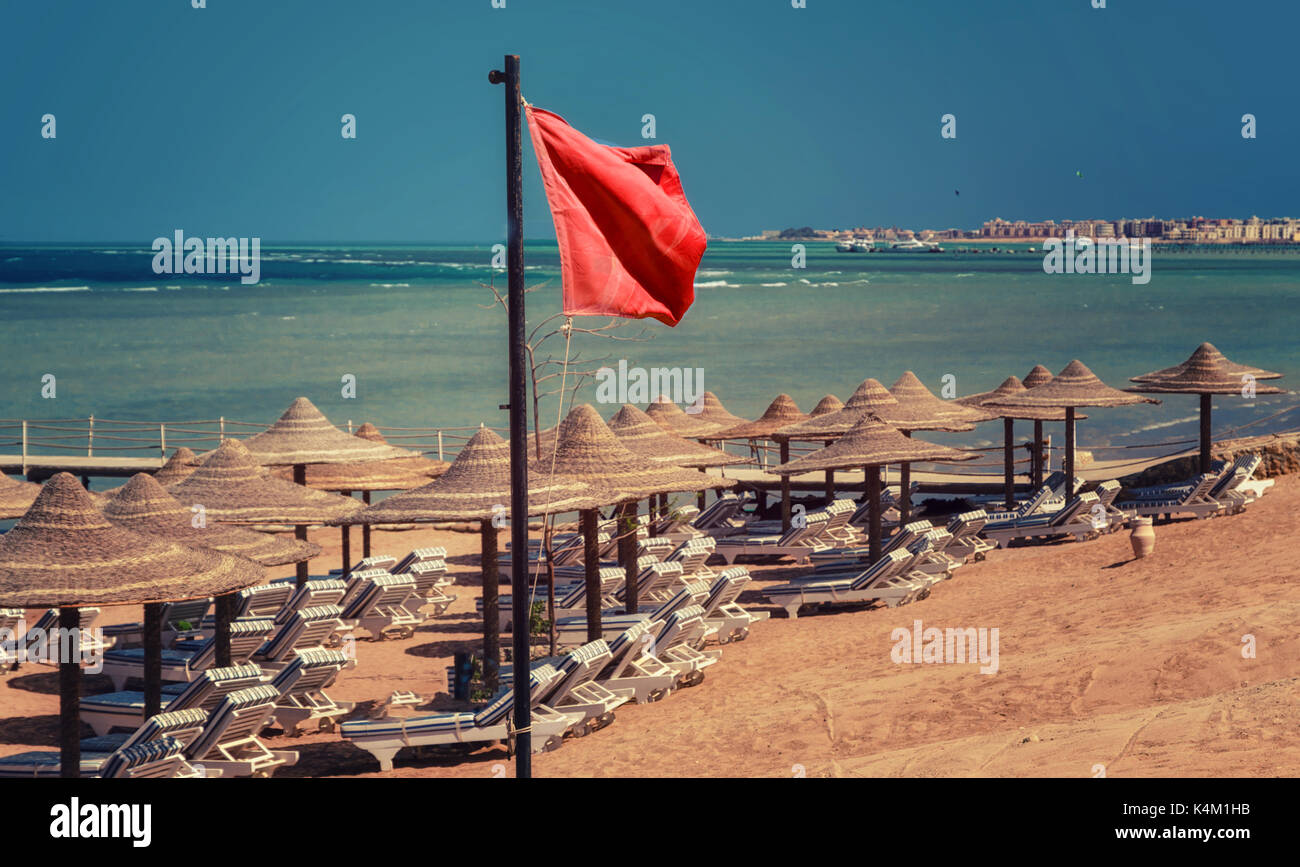 Red warning flag on beach Stock Photo - Alamy