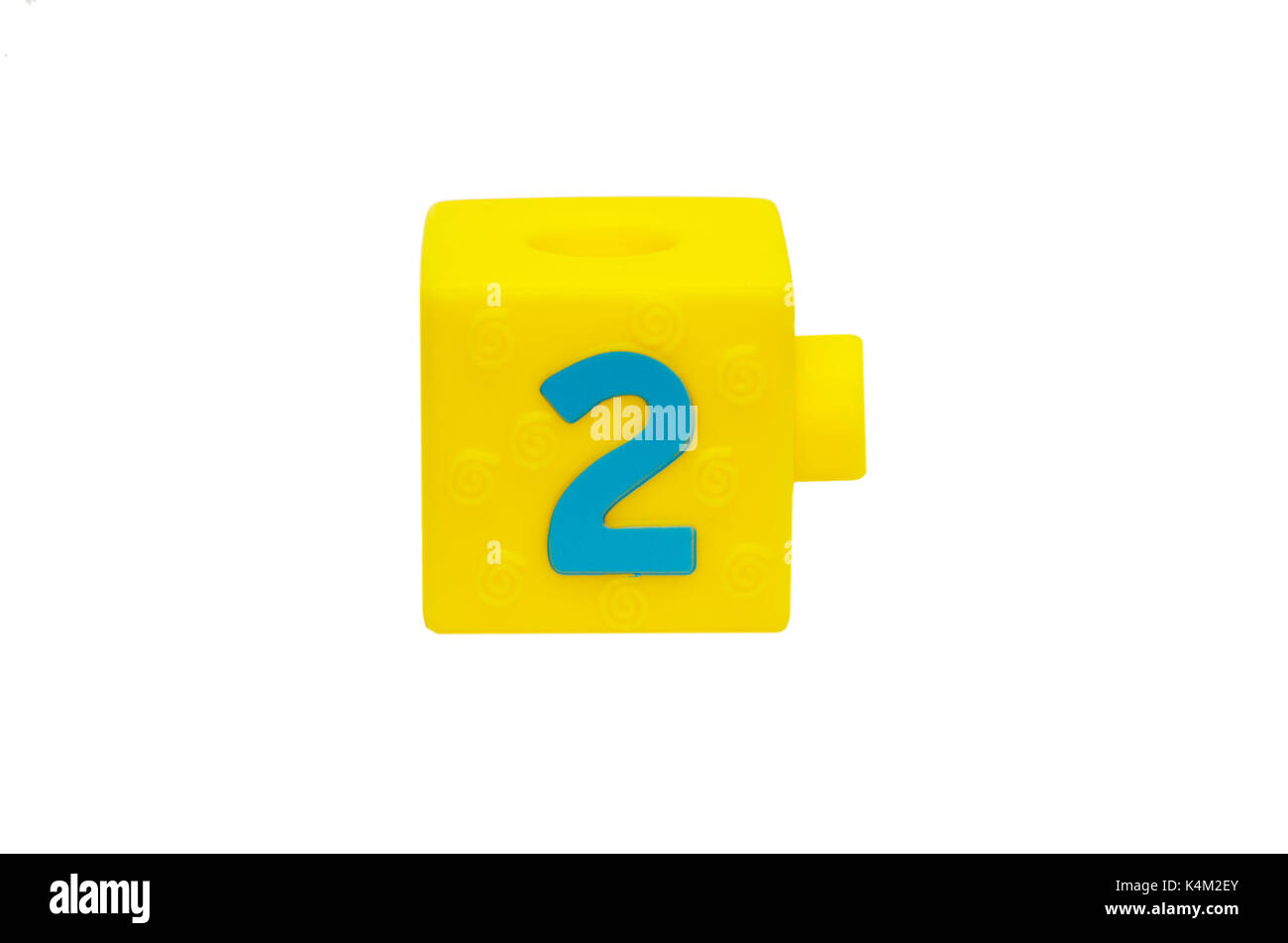 Yellow cube toy isolated on white Stock Photo - Alamy