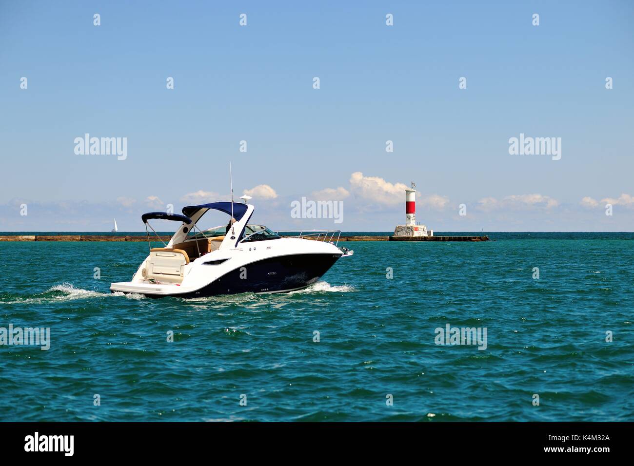 A pleasure craft making its way to the open water of Lake Michigan from ...