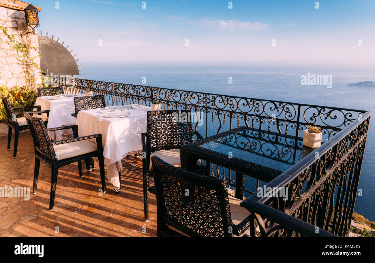 Empty dining table with stunning views overlooking the French Riveira ...