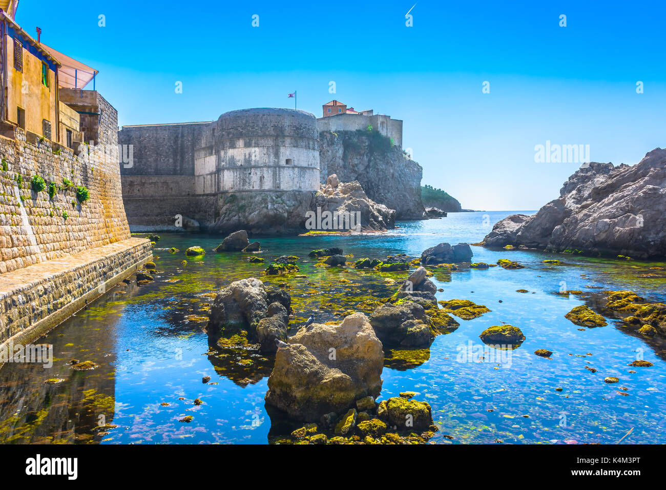 Seafront view at famous city walls of town Dubrovnik by the sea ...