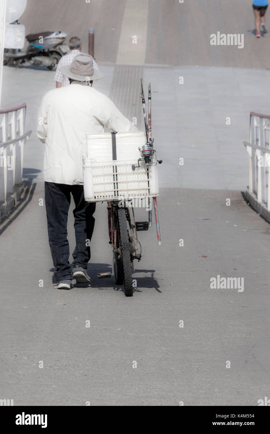 The fisherman with the bicycle Stock Photo - Alamy