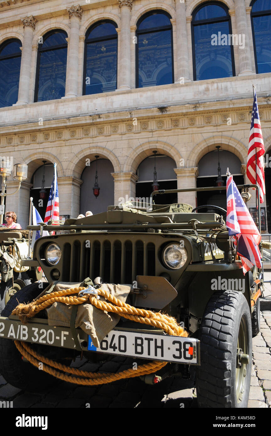 People dress up in US army uniform and military vehicles in front of ...