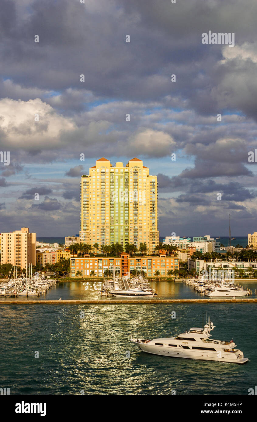 Tall coastal modern waterfront apartment block and marina, Miami Beach ...