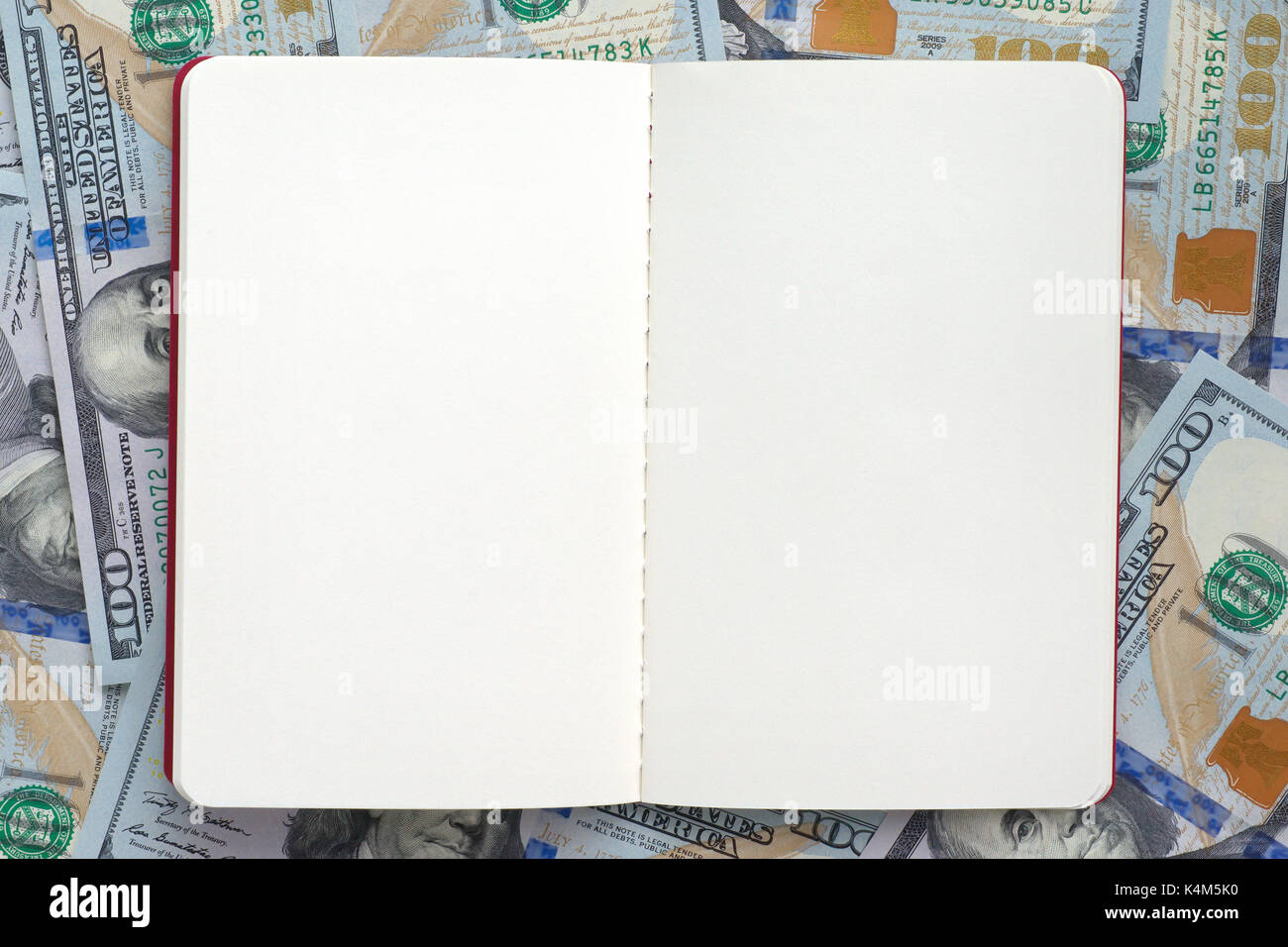 Open notepad on dollar notes background. Business and finance theme ...