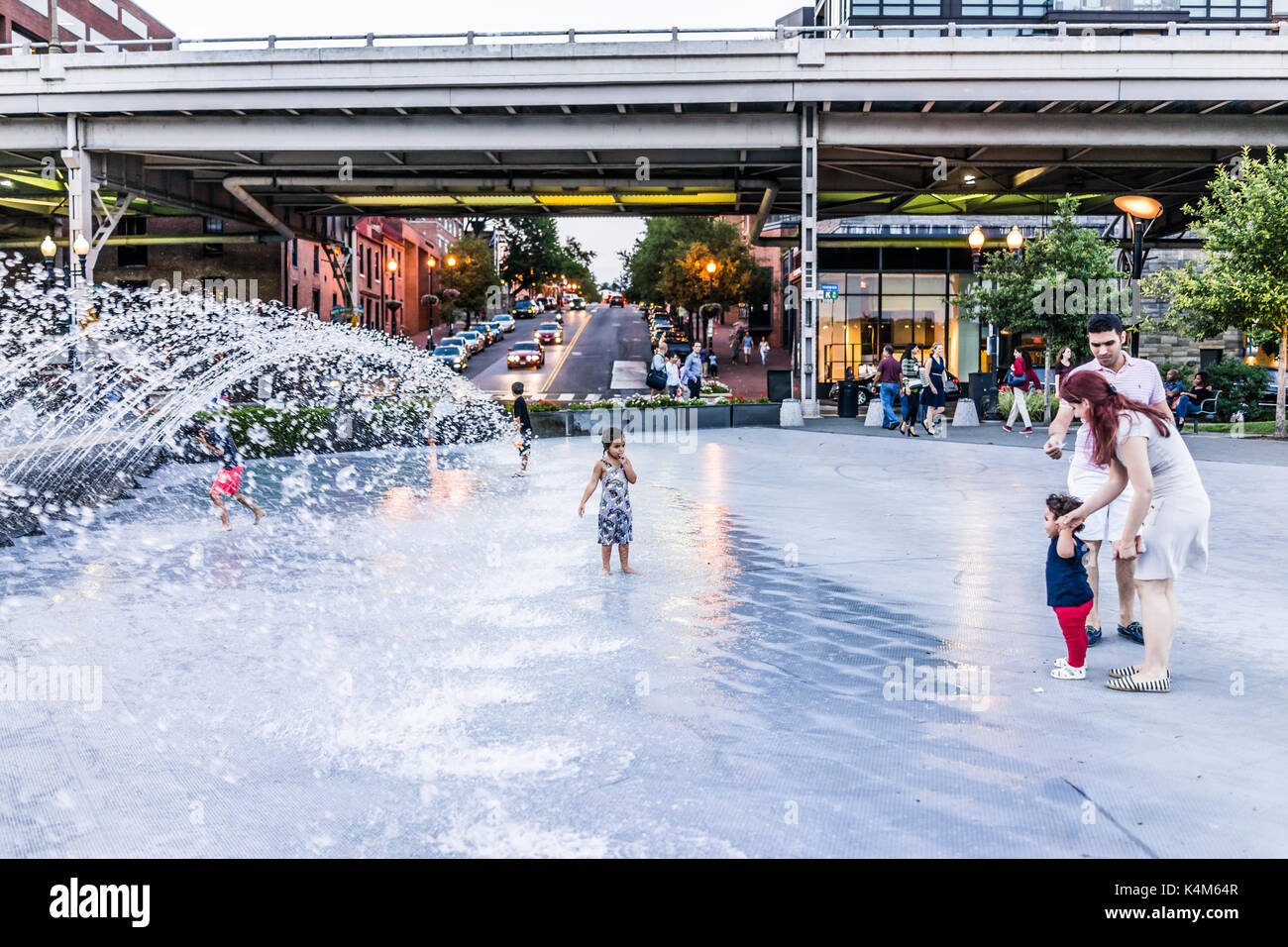 Washington DC, USA - August 4, 2017: Young children playing in water ...