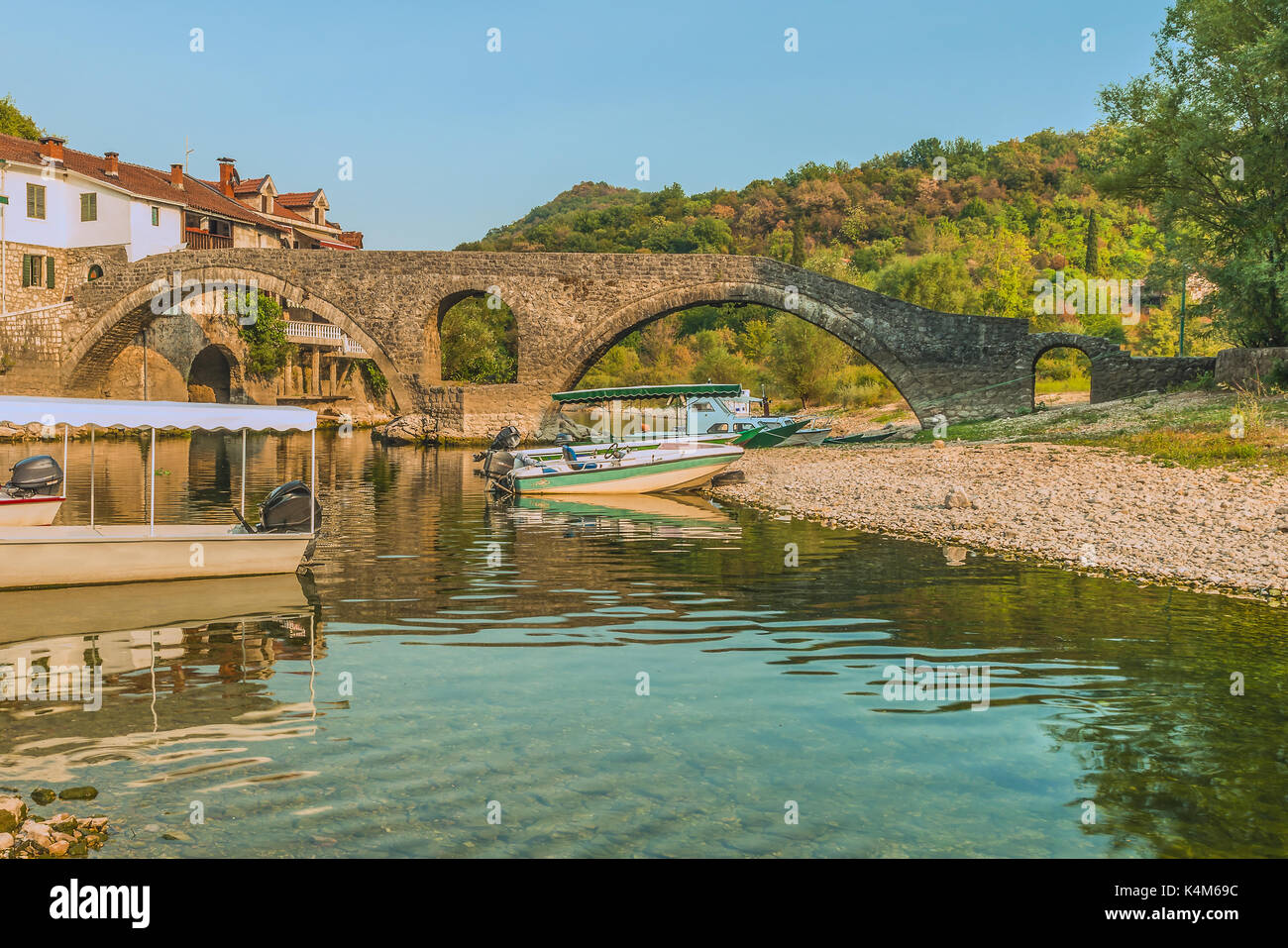 The old arched stone bridge of Crnojevica river on Montenegro Stock Photo - Alamy