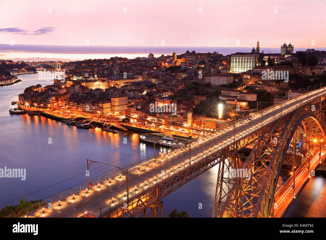 Porto skyline and Douro River at dusk with Dom Luis I Bridge on the ...