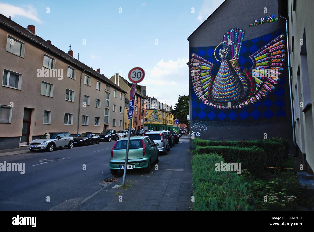 Street in Cologne, one house with Mural Stock Photo - Alamy