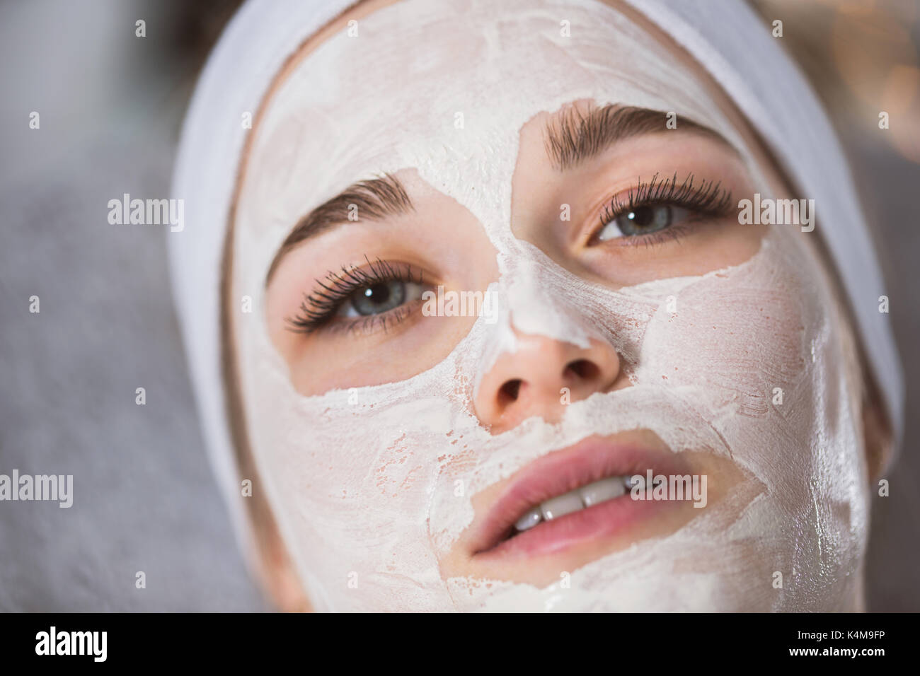 Woman during spa treatment with mask on her face Stock Photo - Alamy
