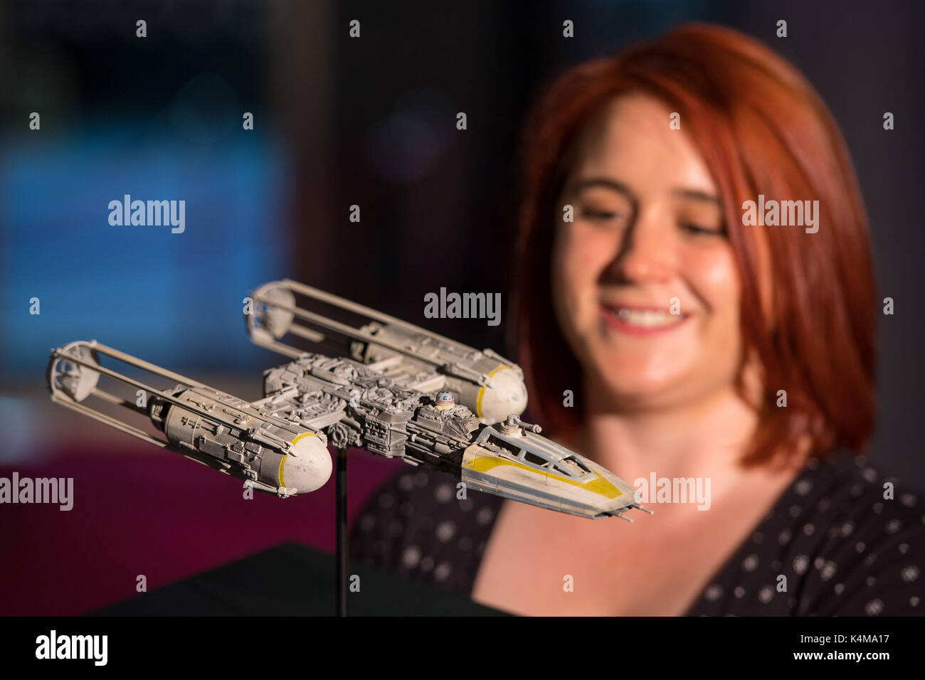 Sian Taylor holds a Y-Wing model miniature, from 'Star Wars: Return of ...