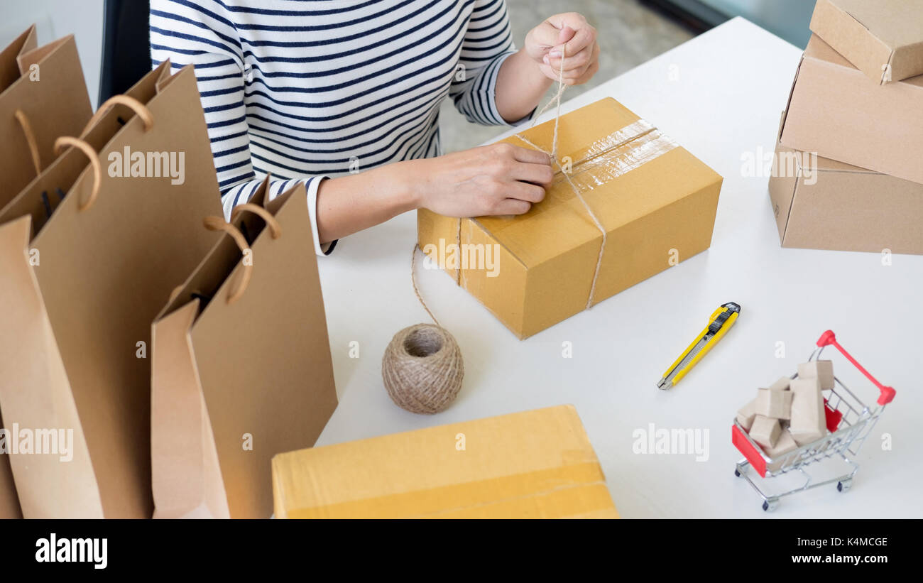 Business owner woman working online shopping prepare product packaging ...