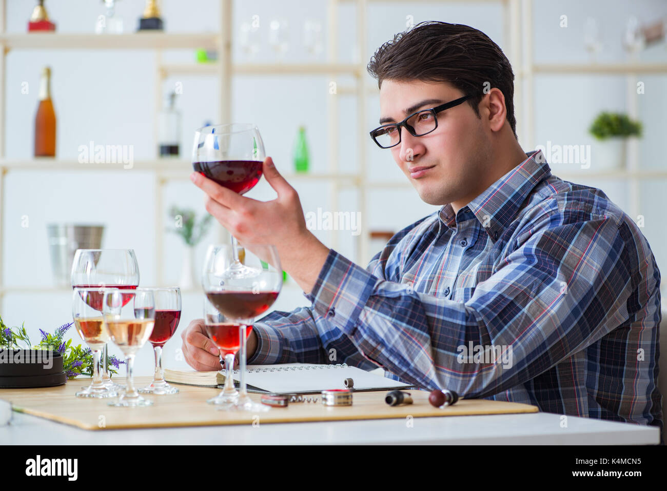 Professional sommelier tasting red wine Stock Photo - Alamy