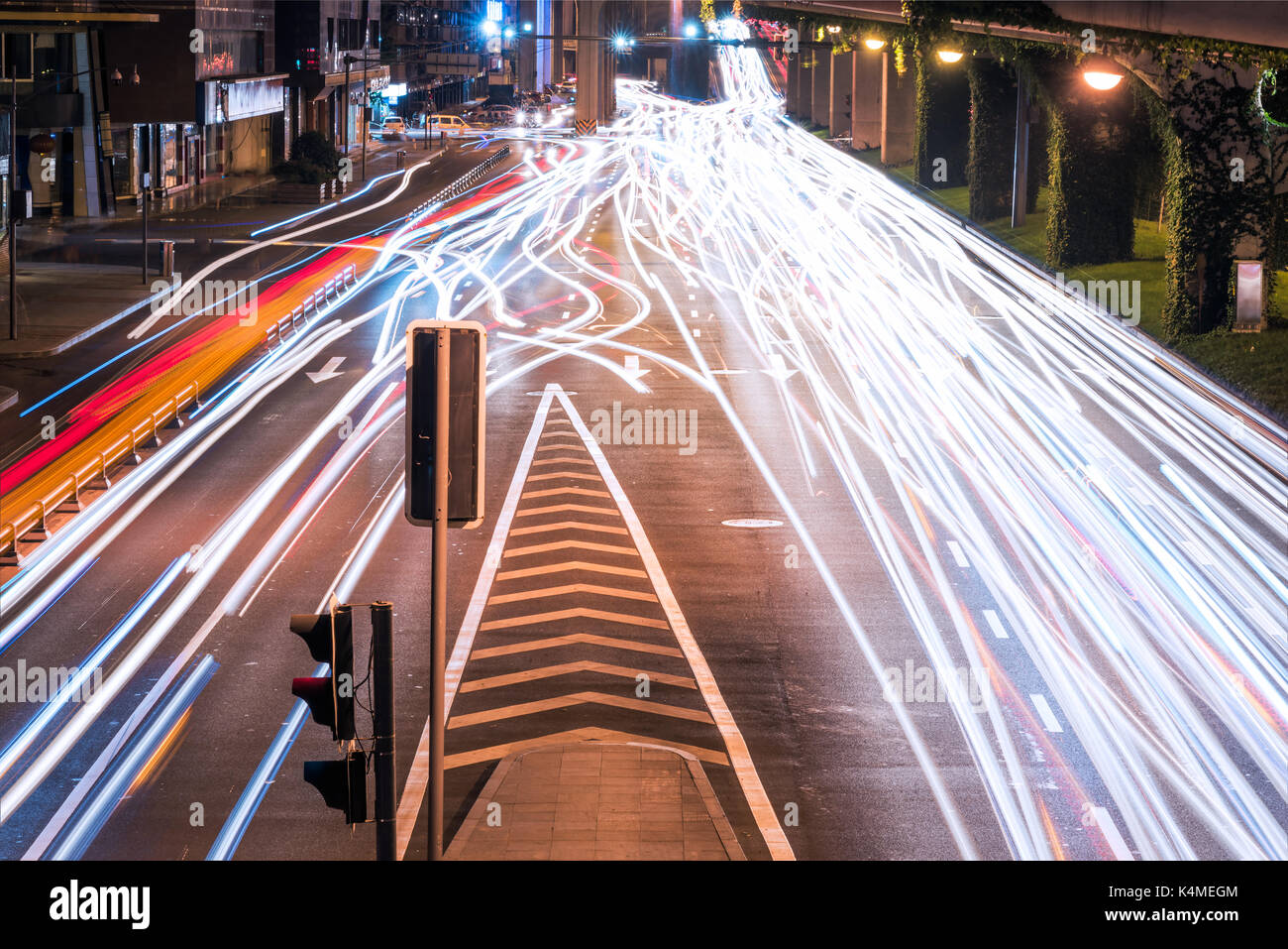 Car traffic at night on a chinese urban highway road in Chengdu city ...