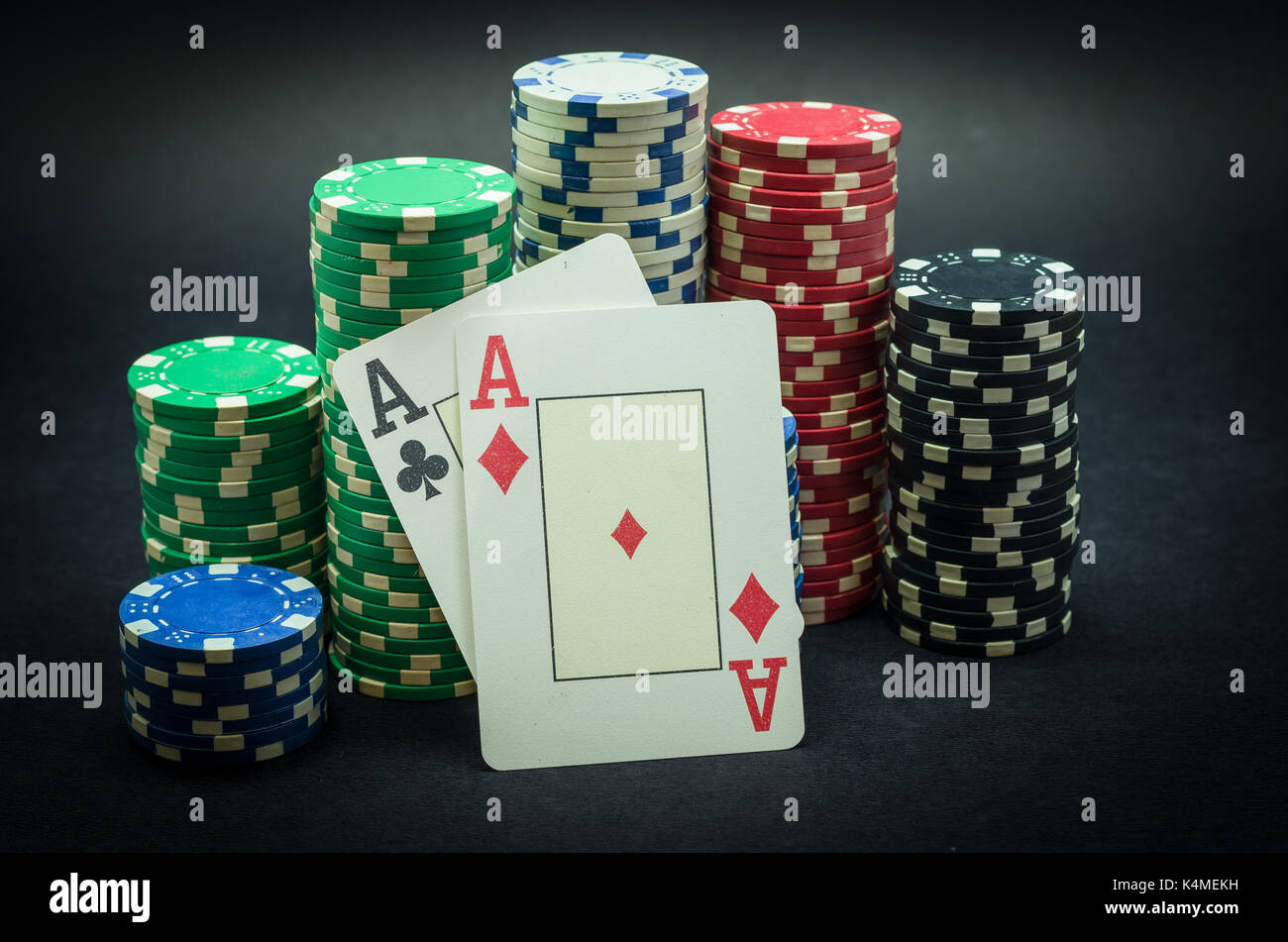 Pair of ace winner, poker chips stacked and pair of aces, black ...